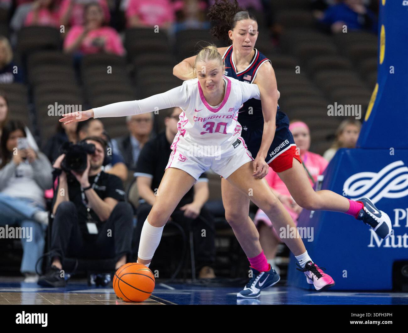 Creighton's Norah Gessert (30) battles for a loose ball against UConn's ...