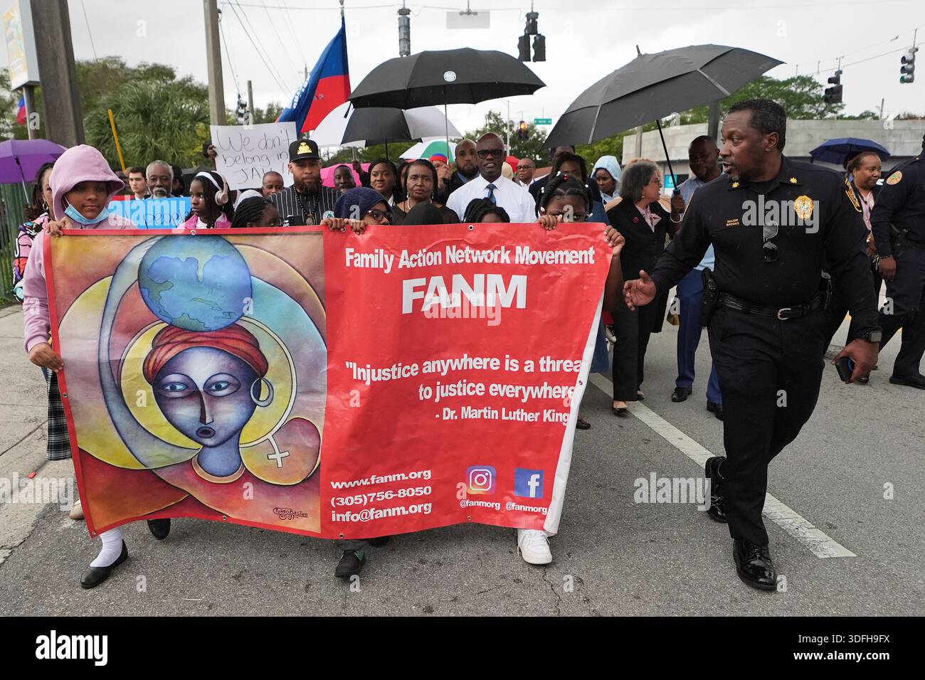 People march during a vigil to mark the anniversary of Haiti's 2010 ...