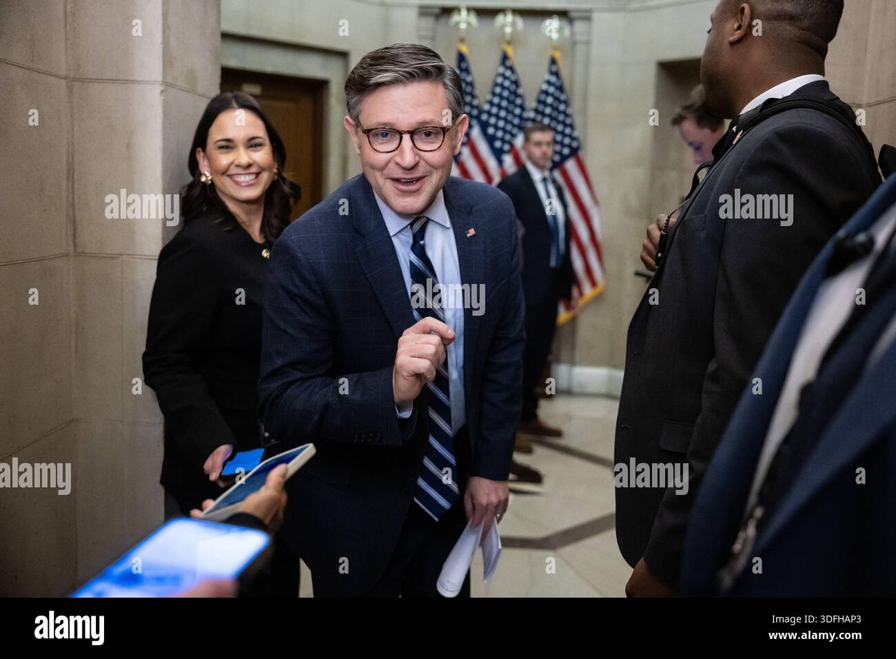 House Speaker Mike Johnson (R-La.) stops to speak with reporters ...