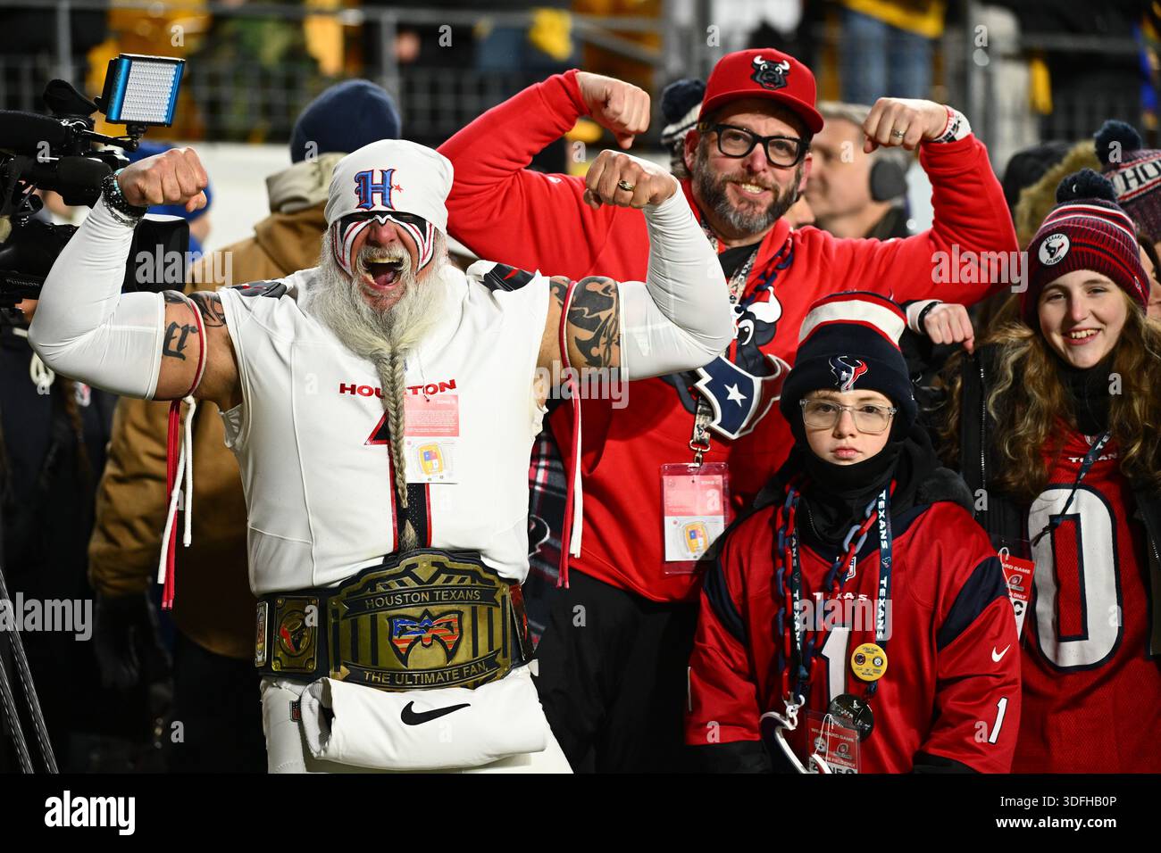 Houston Texans fans pose for photos before an NFL wild-card playoff ...