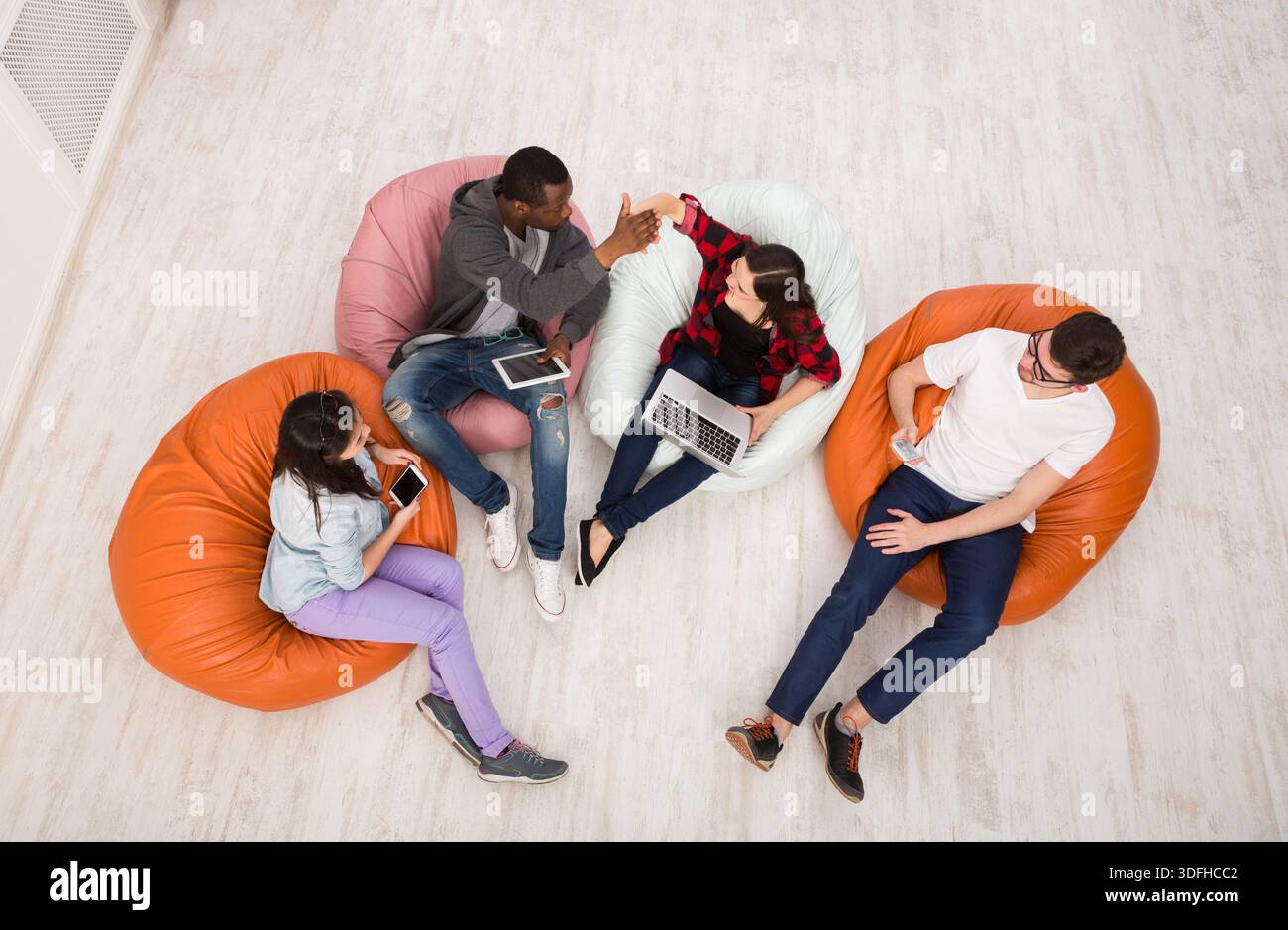 Top view diverse friends sitting hi-res stock photography and images ...