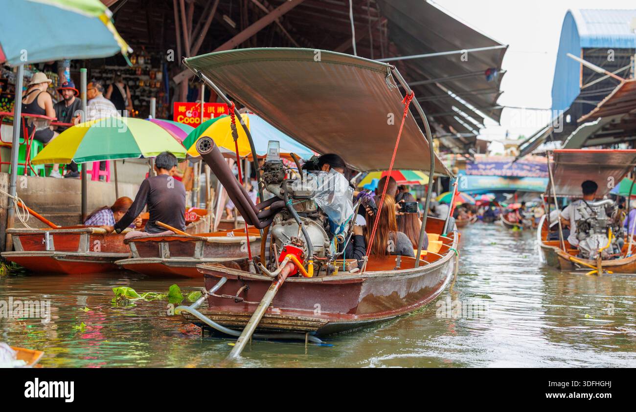 Damnoen Saduak, June 14, 2025. Tourists take boat rides while touring ...
