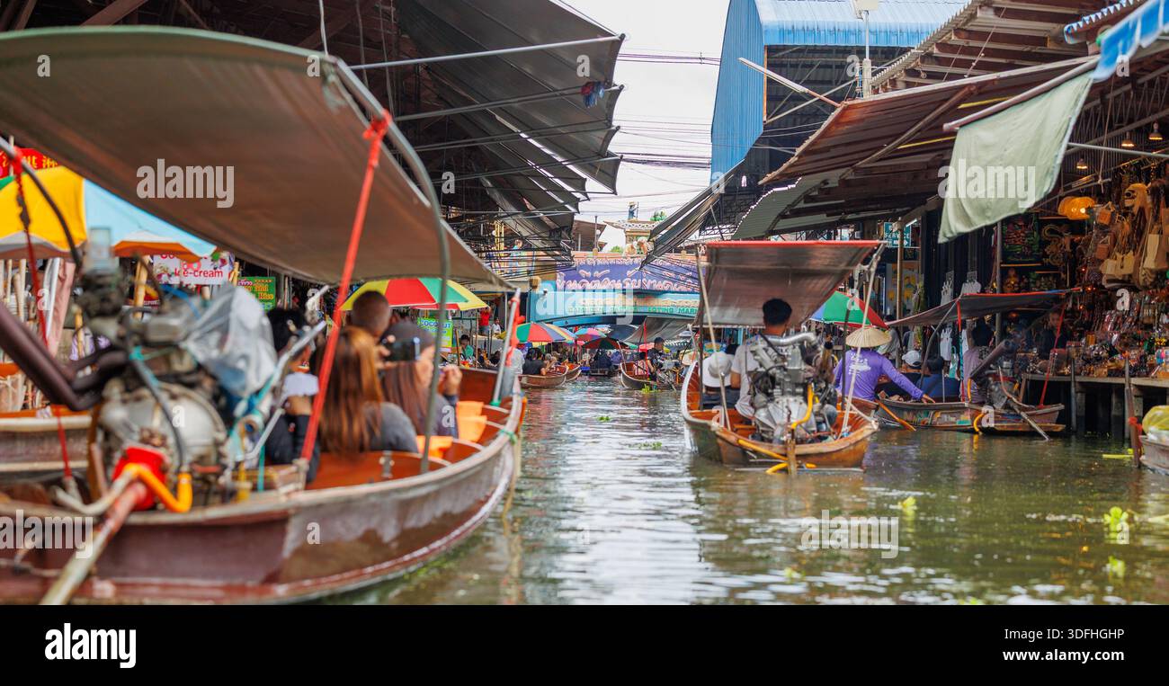 Damnoen Saduak, June 14, 2025. Tourists take boat rides while touring ...