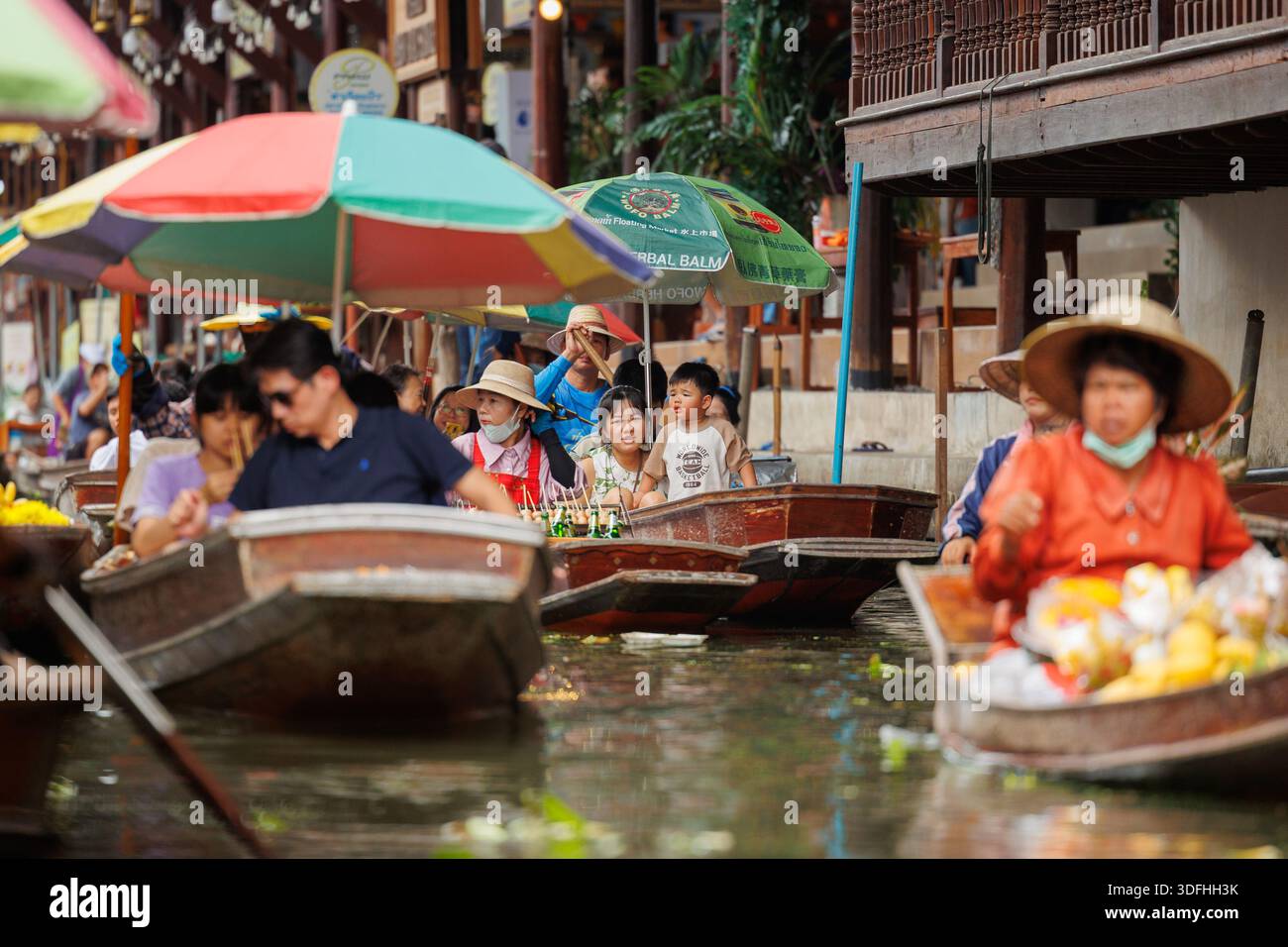 Damnoen Saduak, June 14, 2025. Tourists take boat rides while touring ...