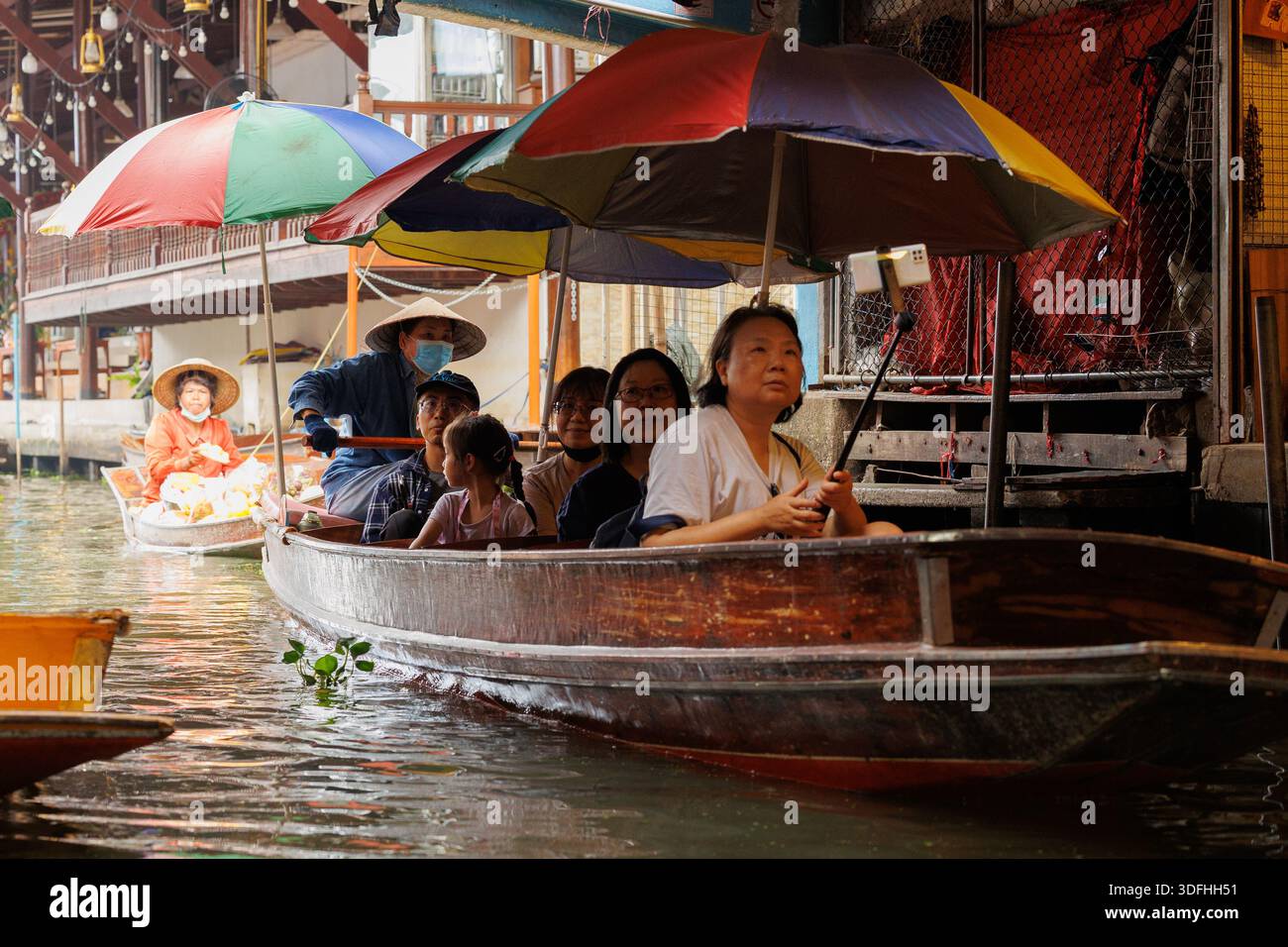 Damnoen Saduak, June 14, 2025. Tourists take boat rides while touring ...