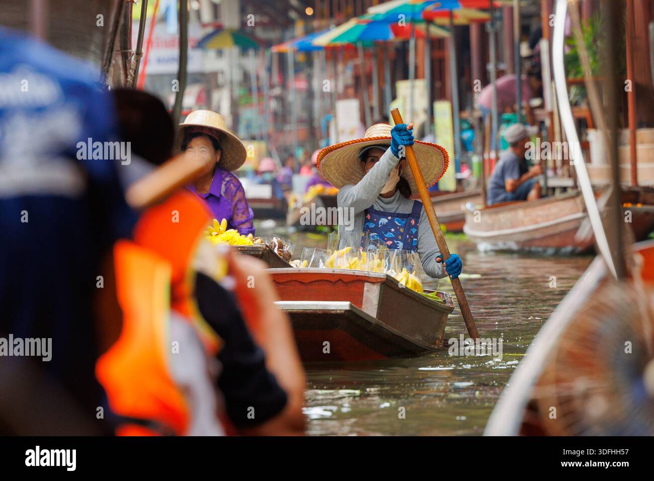 Damnoen Saduak, June 14, 2025. Tourists take boat rides while touring ...