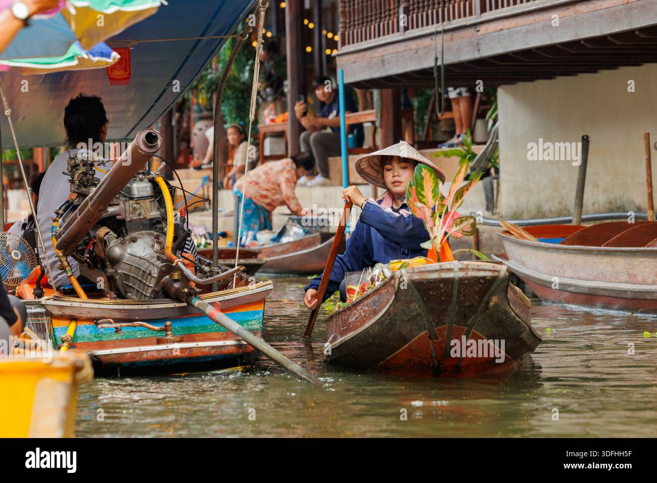 Damnoen Saduak, June 14, 2025. Tourists take boat rides while touring ...