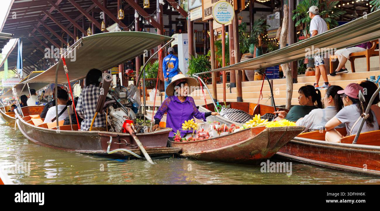 Damnoen Saduak, June 14, 2025. Tourists take boat rides while touring ...