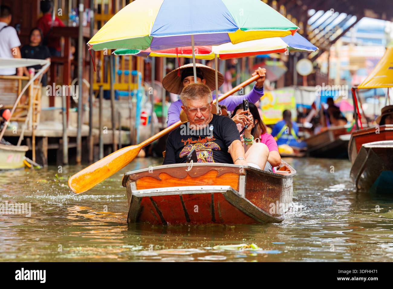 Damnoen Saduak, June 14, 2025. Tourists take boat rides while touring ...