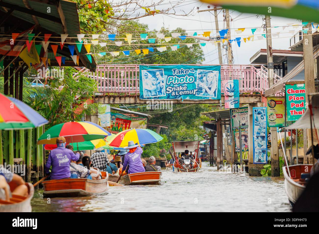 Damnoen Saduak, June 14, 2025. Tourists take boat rides while touring ...