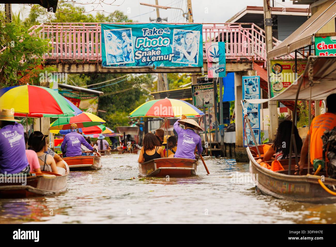 Damnoen Saduak, June 14, 2025. Tourists take boat rides while touring ...