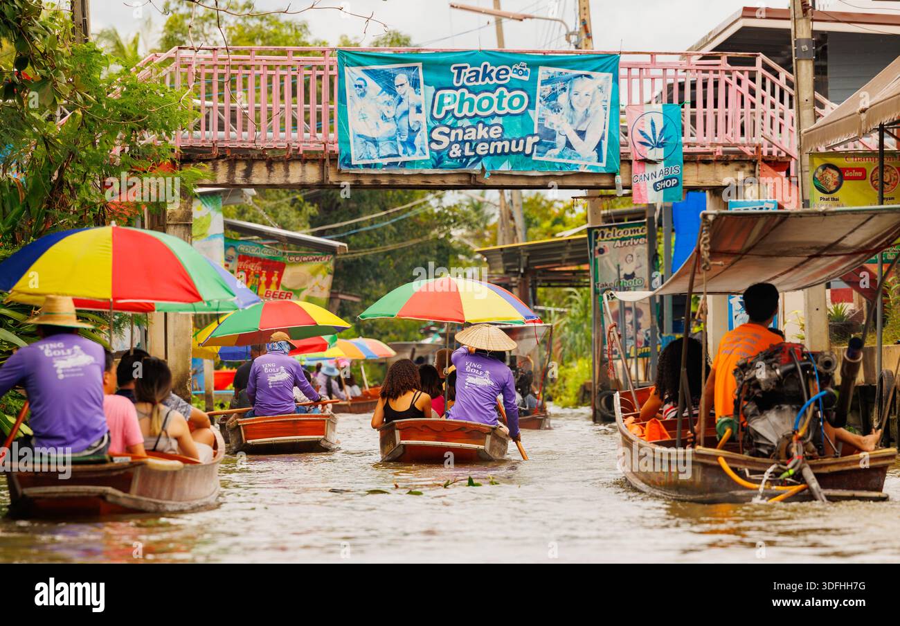 Damnoen Saduak, June 14, 2025. Tourists take boat rides while touring ...