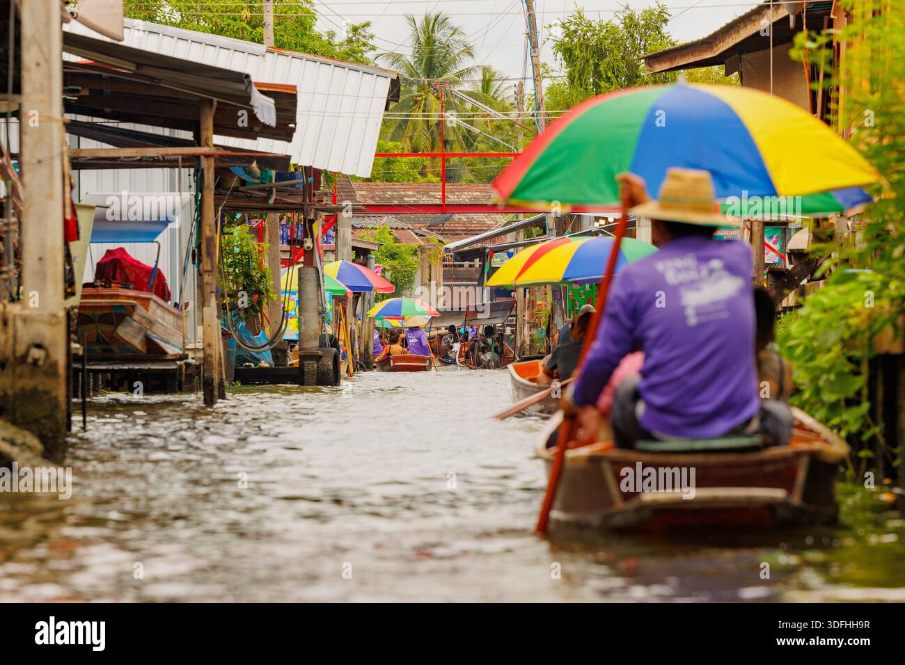 Damnoen Saduak, June 14, 2025. Tourists take boat rides while touring ...