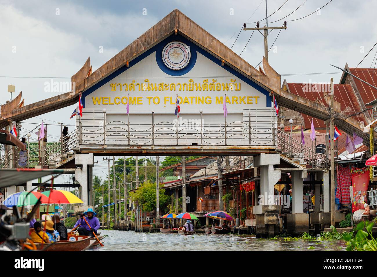 Damnoen Saduak, June 14, 2025. Welcome to Floating Market sign is ...