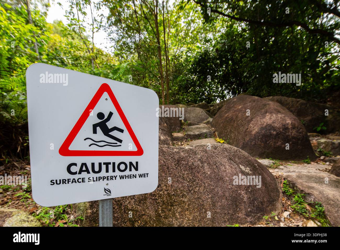 Signboard caution to climber about surface slippery when wet during ...