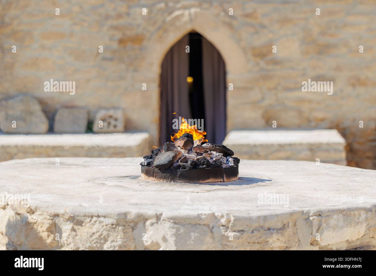 Close up view of a gas fire pit at the Atashgah Zoroastrian Fire Temple ...