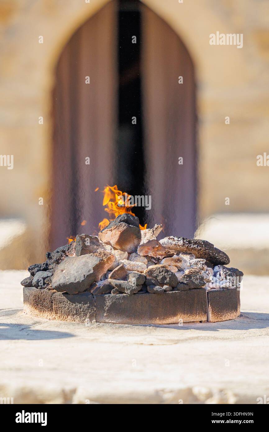 Close up view of a gas fire pit at the Atashgah Zoroastrian Fire Temple ...