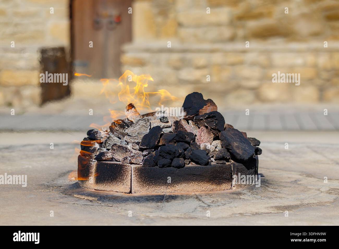 Close up view of a gas fire pit at the Atashgah Zoroastrian Fire Temple ...