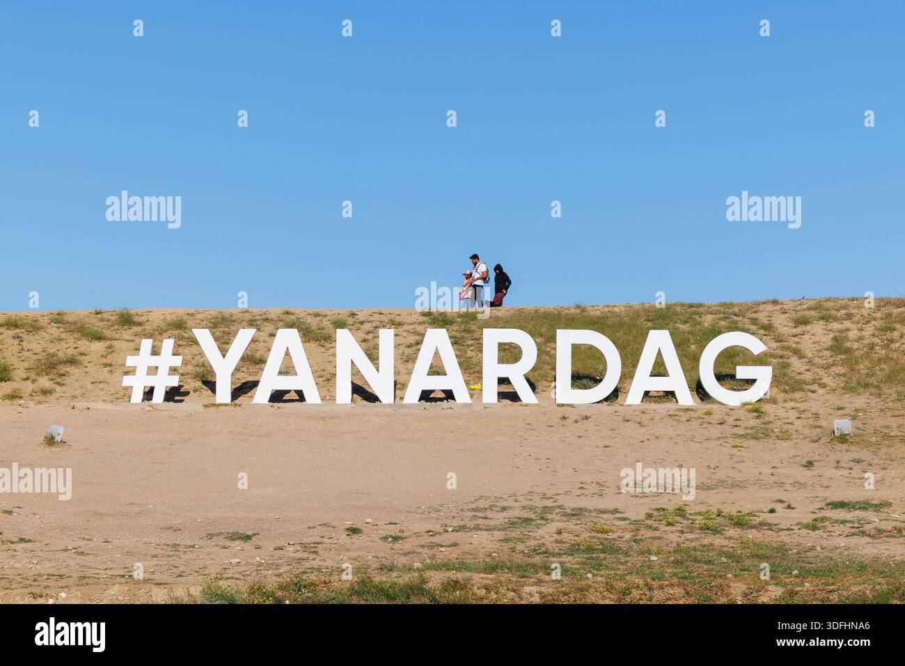 Baku, May 17, 2025, Tourist walk past the sign for Yanardag (Burning ...