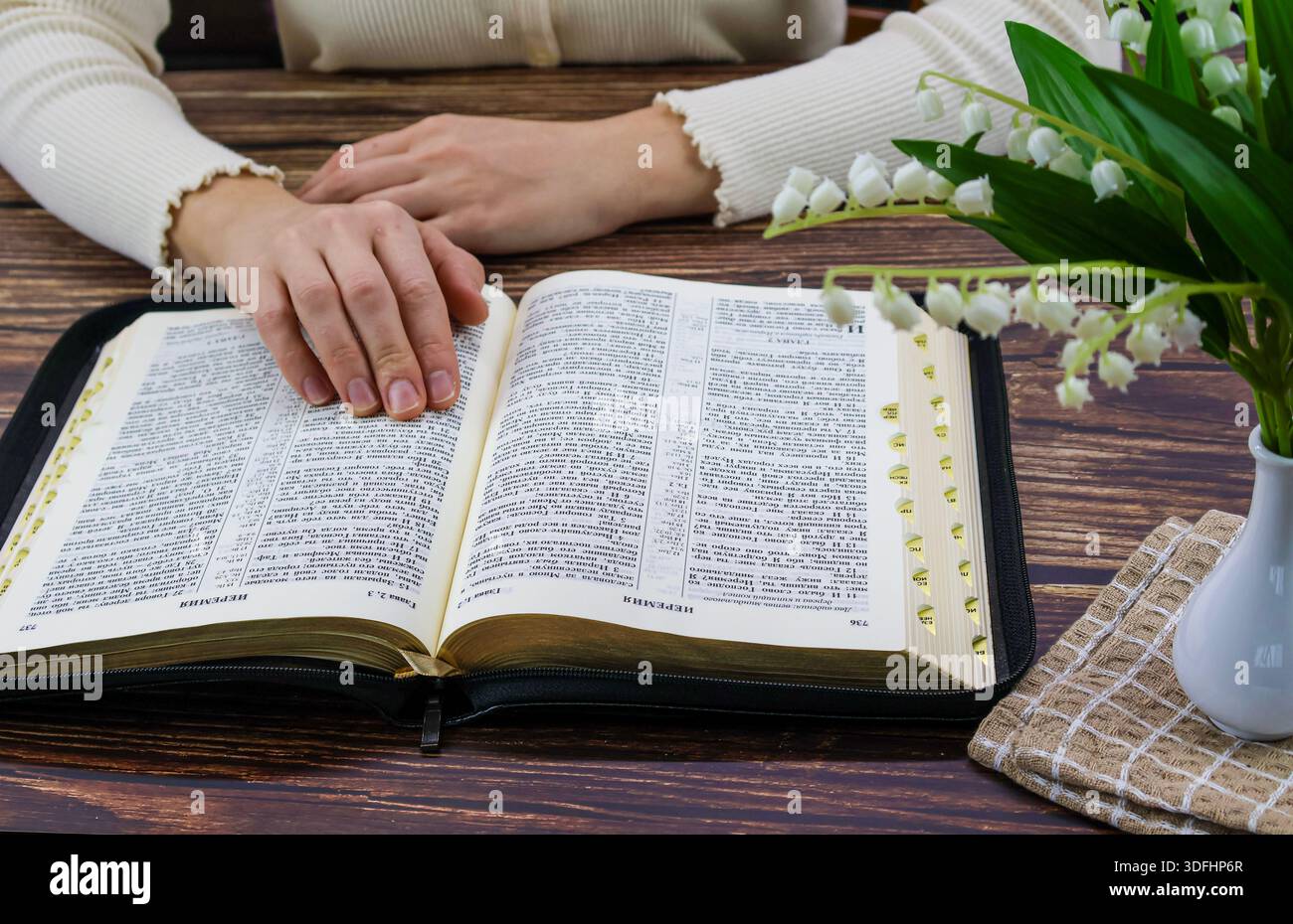 Prayer and Bible Study at Wooden Table with Coffee and Flowers Stock Photo - Alamy