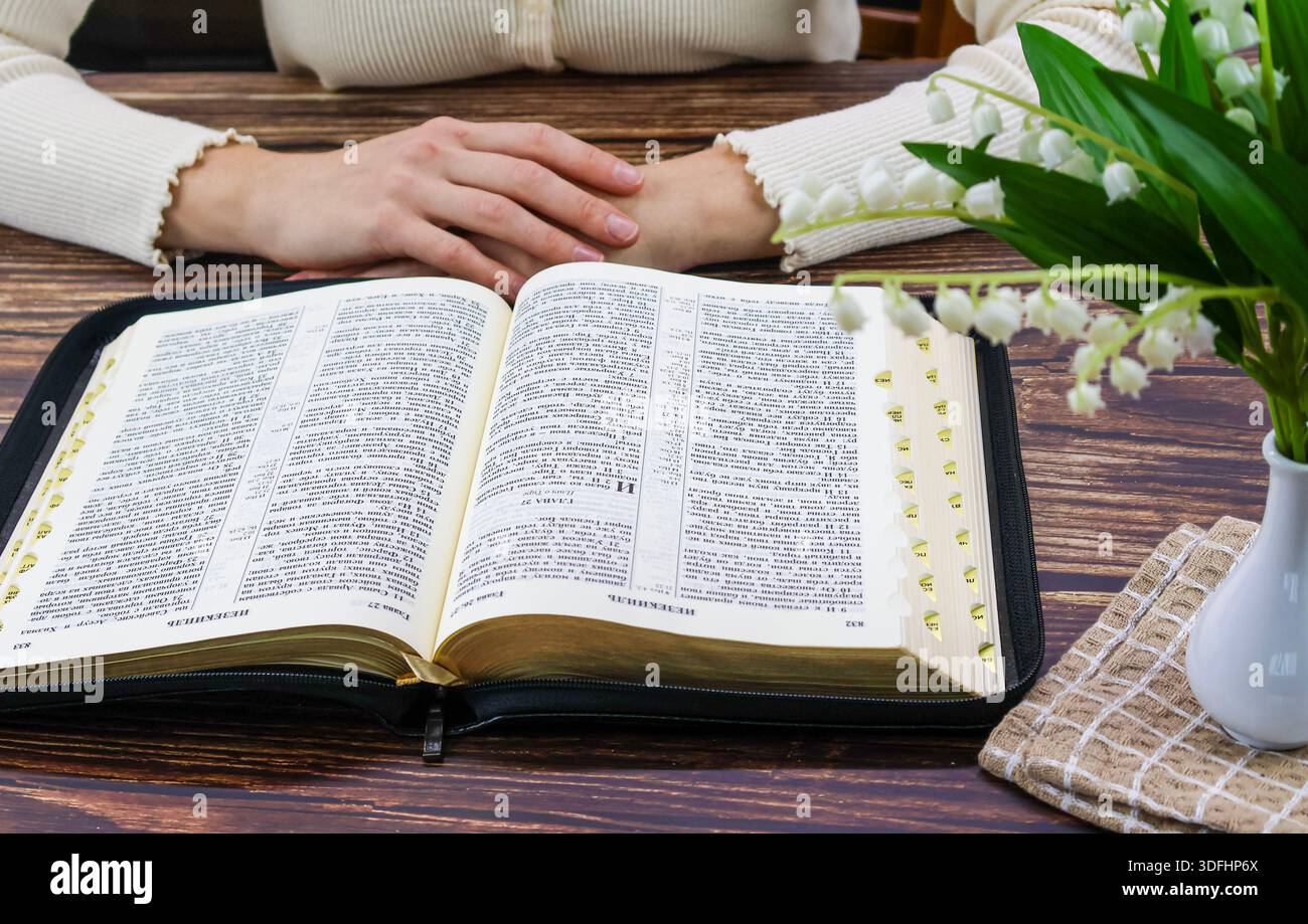 Prayer and Bible Study at Wooden Table with Coffee and Flowers Stock Photo - Alamy
