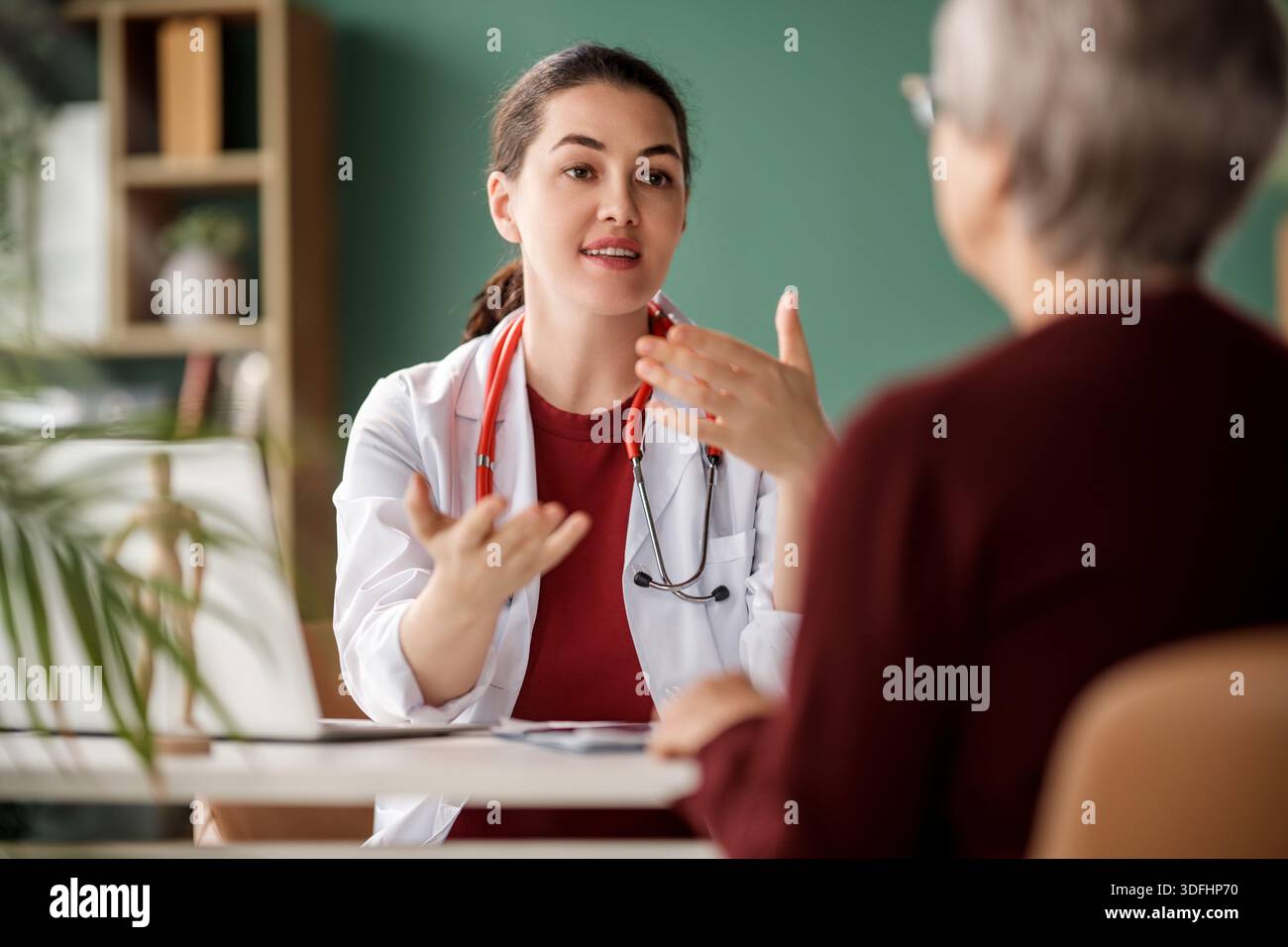 Female patient listening to a doctor in hospital Stock Photo - Alamy