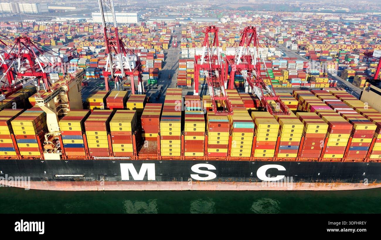 QINGDAO, CHINA - JANUARY 13, 2026 - The cargo ship is loading and ...