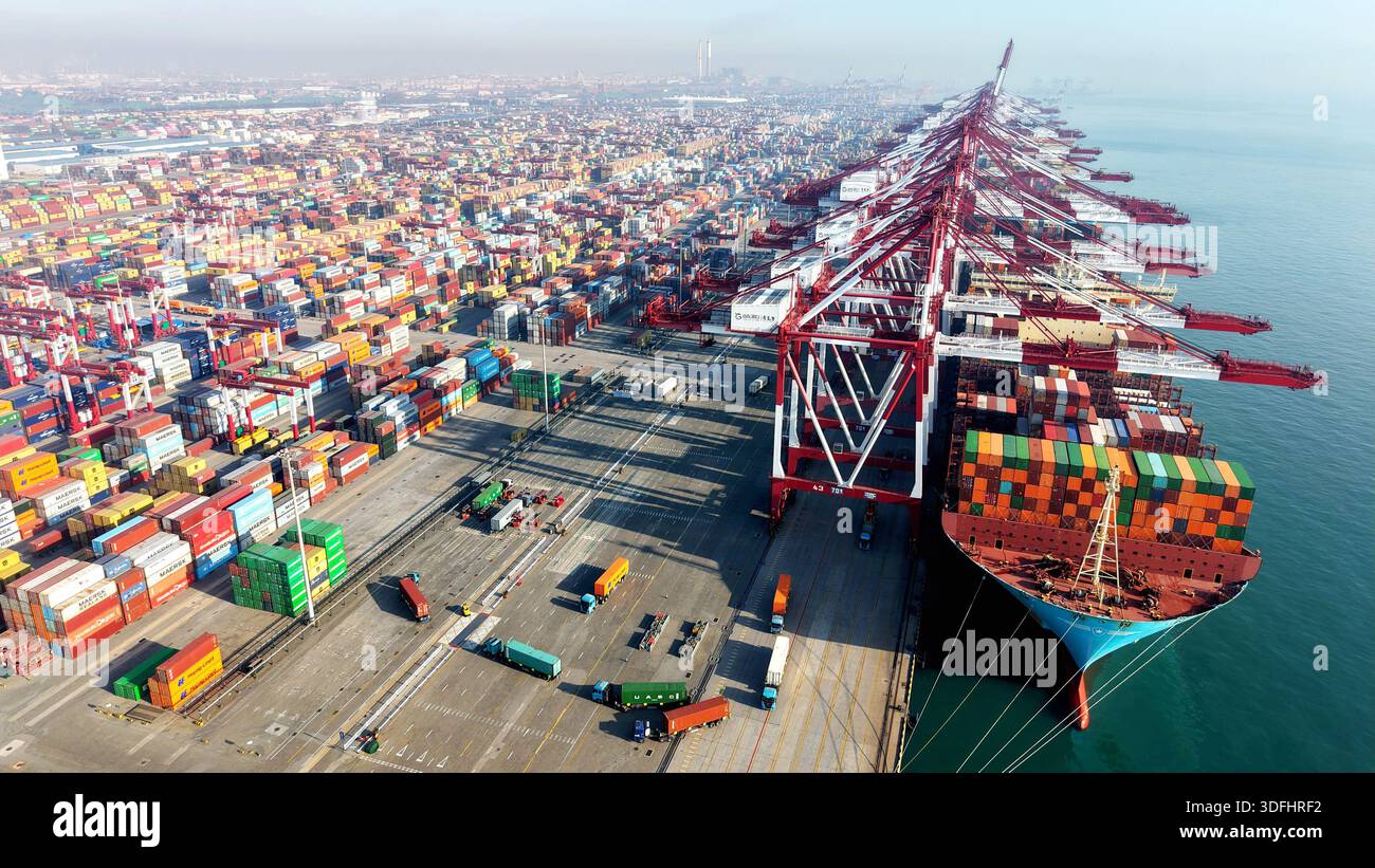 QINGDAO, CHINA - JANUARY 13, 2026 - The cargo ship is loading and ...