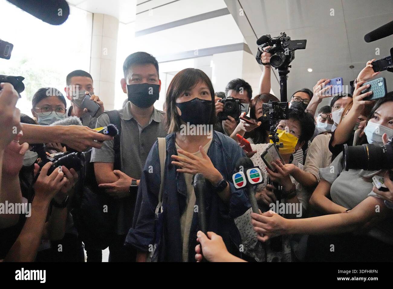 FILE - Chan Pui-man, associate publisher of Apple Daily newspaper walks ...