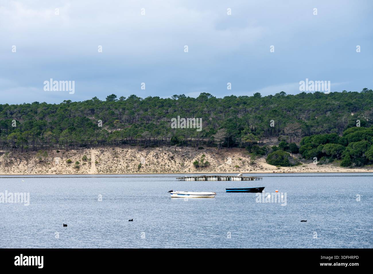Sesimbra Portugal December 25 2025. Small boats float on lagoon water ...