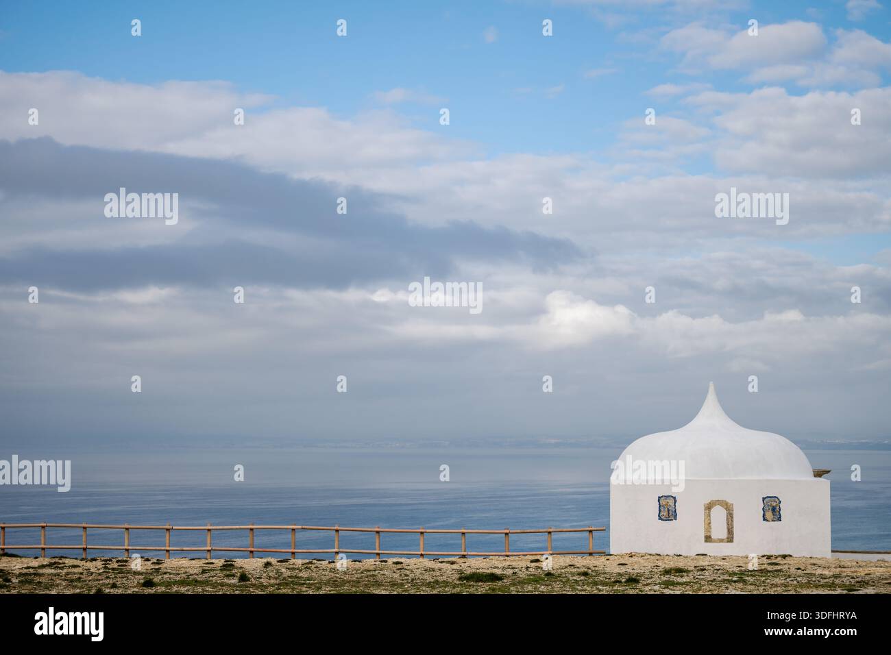 Sesimbra Portugal December 25 2025. A white chapel sits on a coastal ...