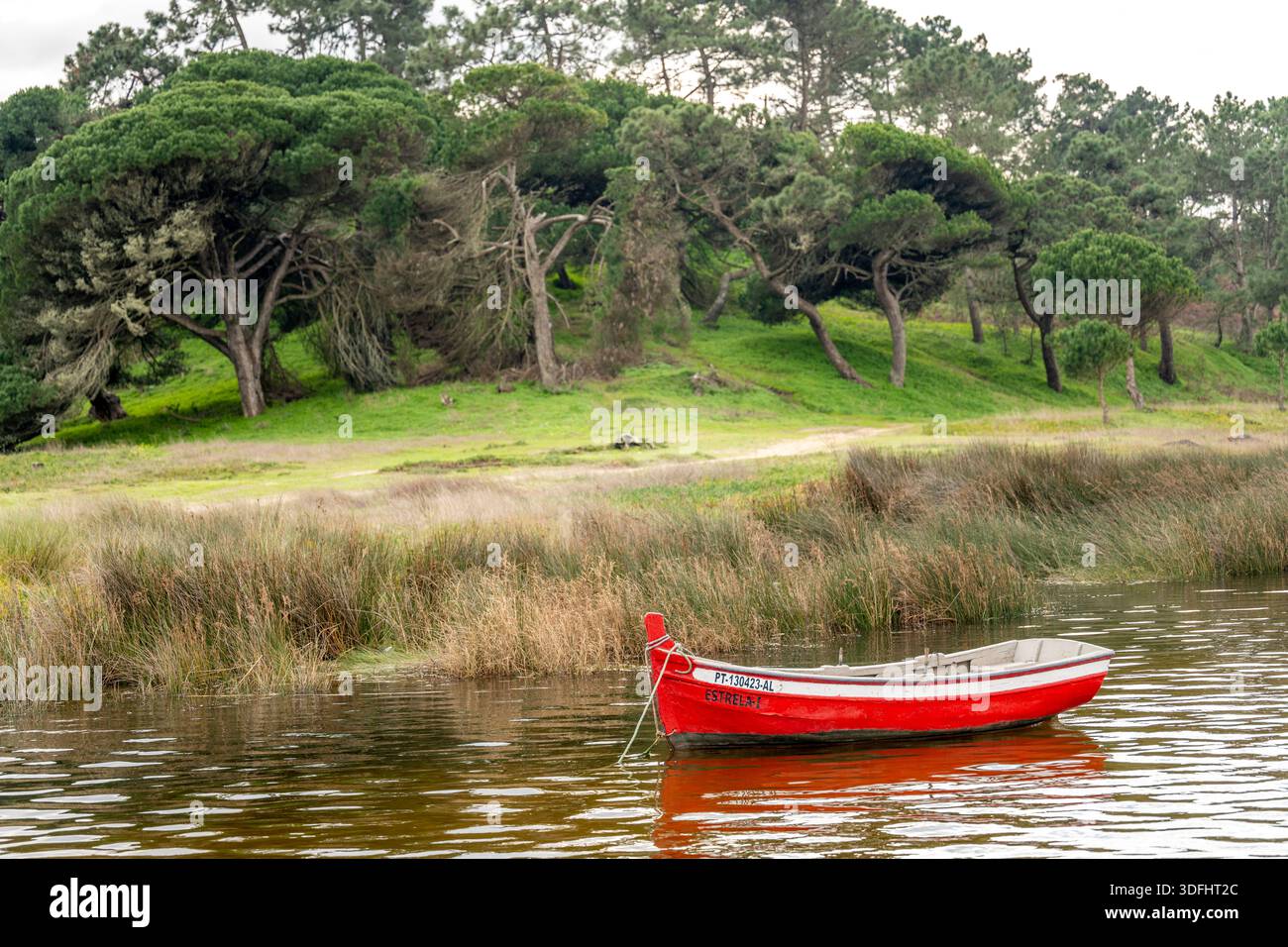 Sesimbra Portugal December 25 2025. A wooden pier extends into calm ...