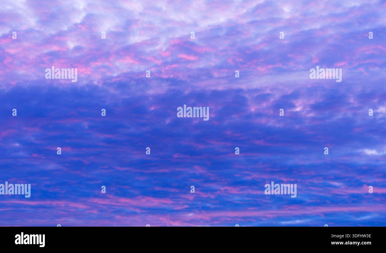Abstract natural sky background with layered soft clouds in purple pink ...
