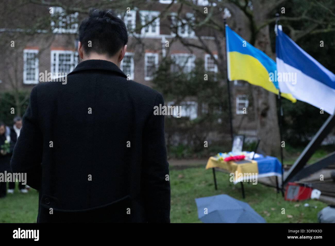 The organiser leading a moment of silence during the memorial service ...