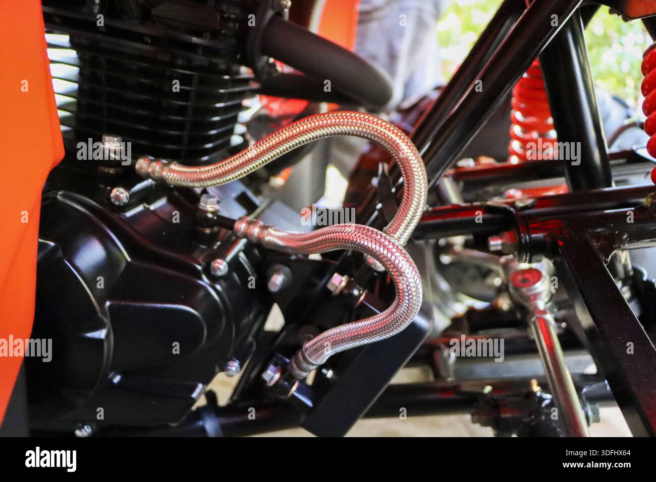 Closeup detailed view black motorcycle engine block with metal oil ...