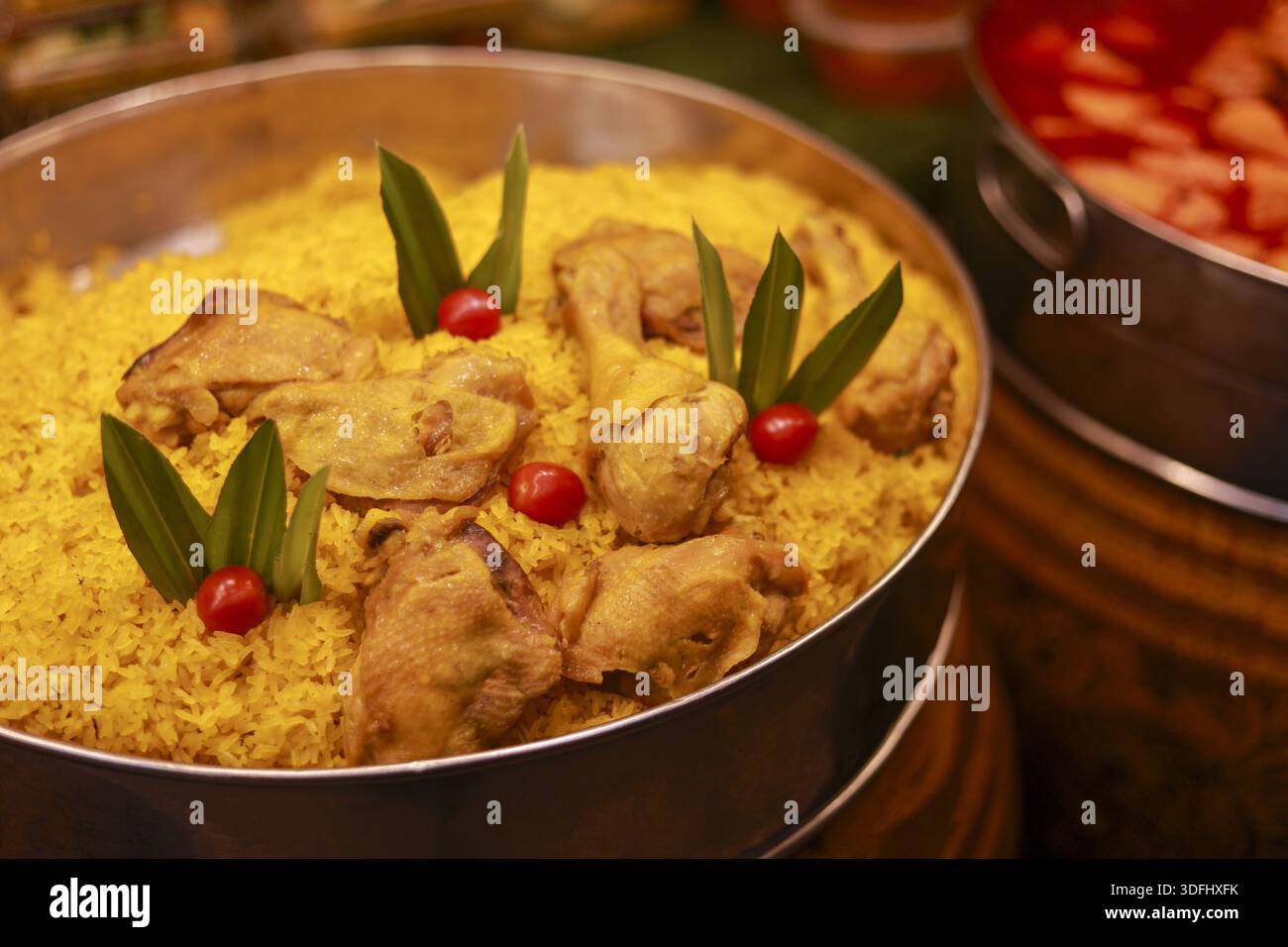 Delicious chicken biryani with yellow rice and savory meat served in ...