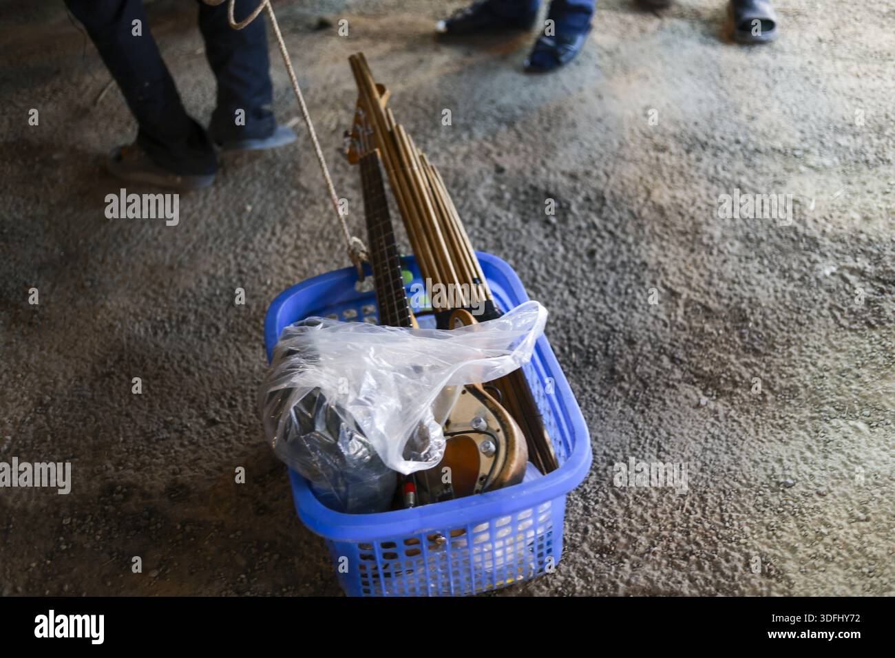 Small blue plastic basket containing wooden firearm rifle or handmade ...