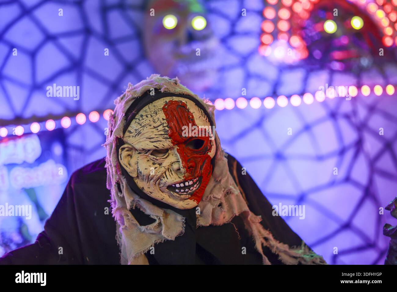 Creepy monster wearing scary mask with fake blood and stringy hair ...