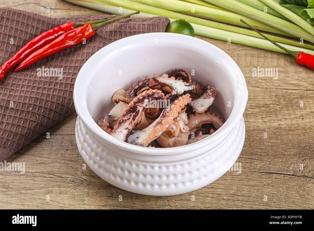 Grilled octopus red tentacle sliced appetizer Stock Photo - Alamy