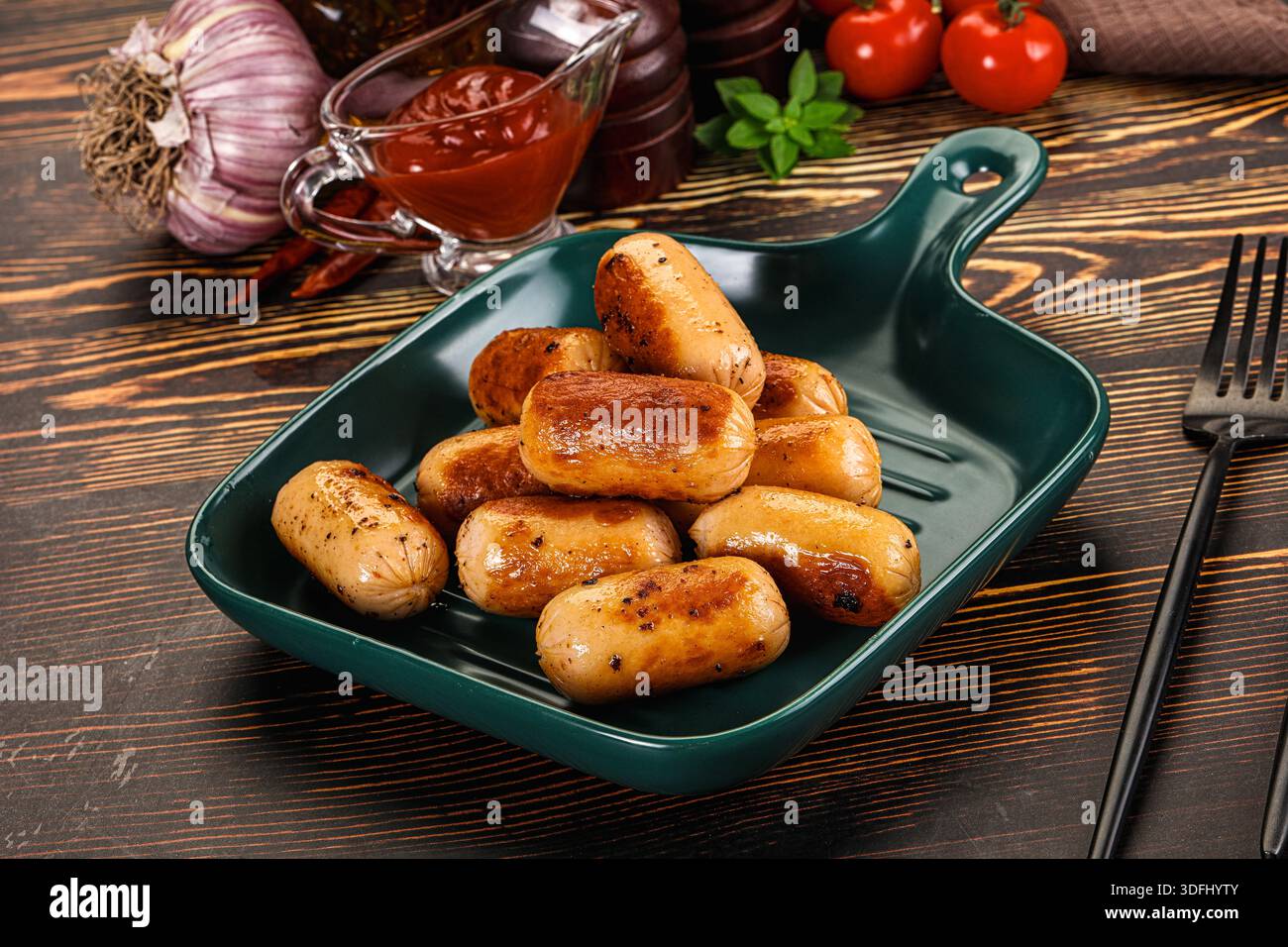 Roasted chicken mini sausages for breakfast in the bowl Stock Photo - Alamy