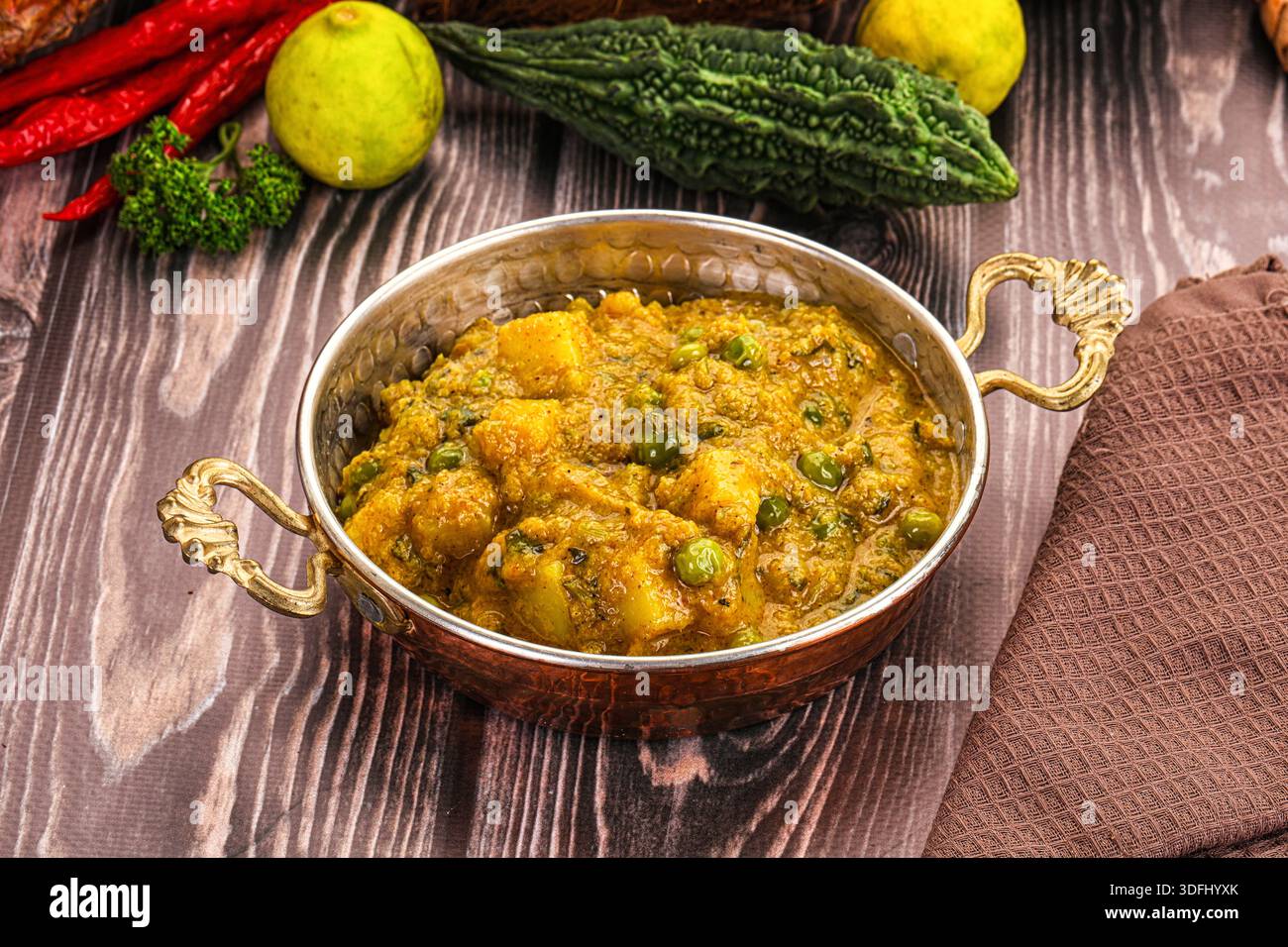 Indian cuisine Aloo masala with green peas - potato Stock Photo - Alamy