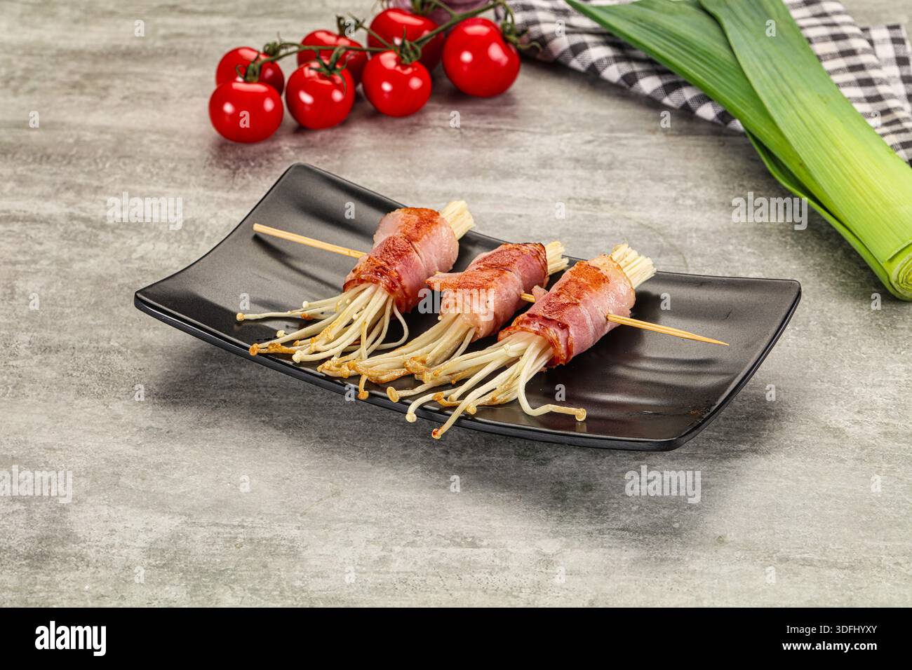 Grilled enoki mushroom with bacon roll wrap Stock Photo - Alamy