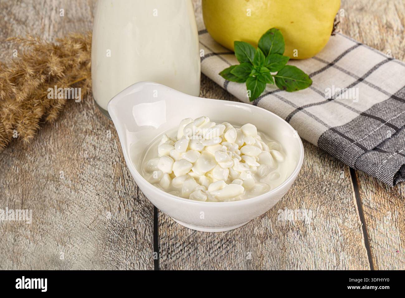Grain cottage cheese with sour in the bowl Stock Photo - Alamy