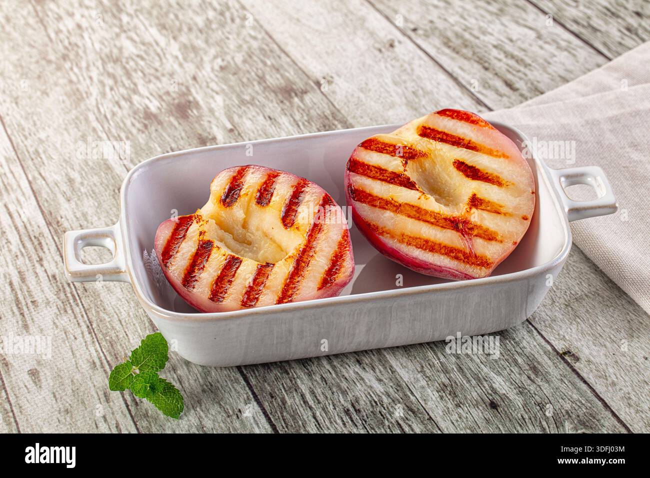 Sweet juicy grilled peaches dietary dessert Stock Photo - Alamy