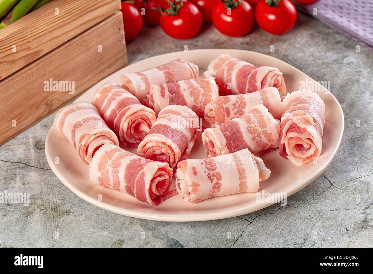Raw bacon pork roll sliced for cooking Stock Photo - Alamy