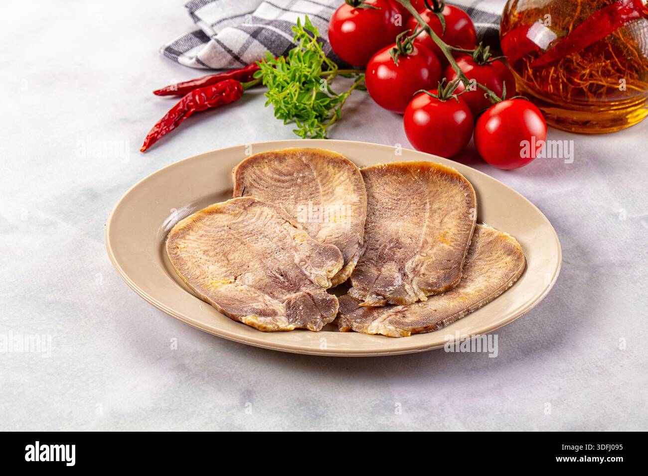 Boiled beef tomgue slices appetizer snack Stock Photo - Alamy