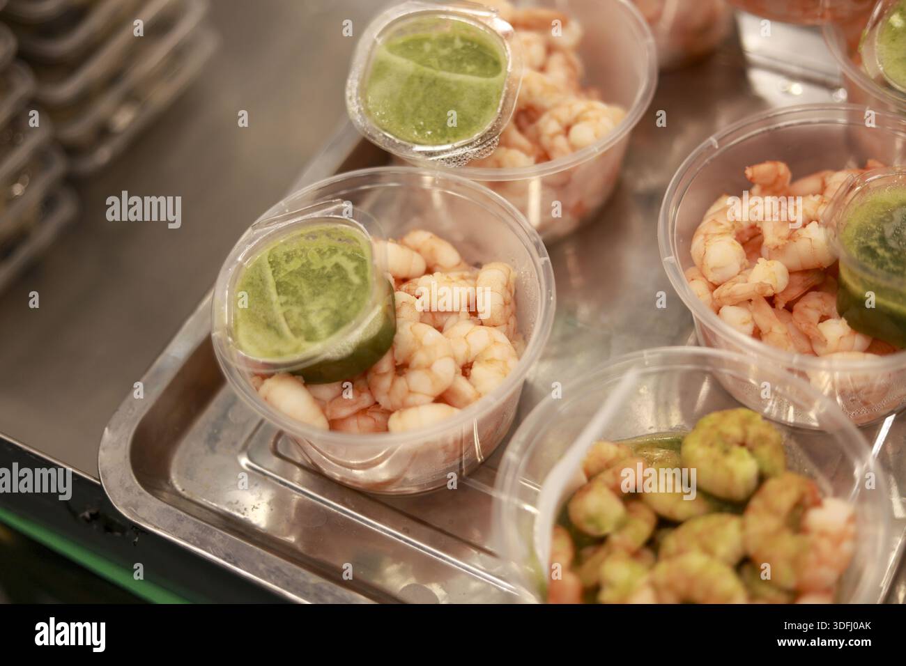 Delicious fresh boiled shrimp meat packed in plastic box with spicy ...