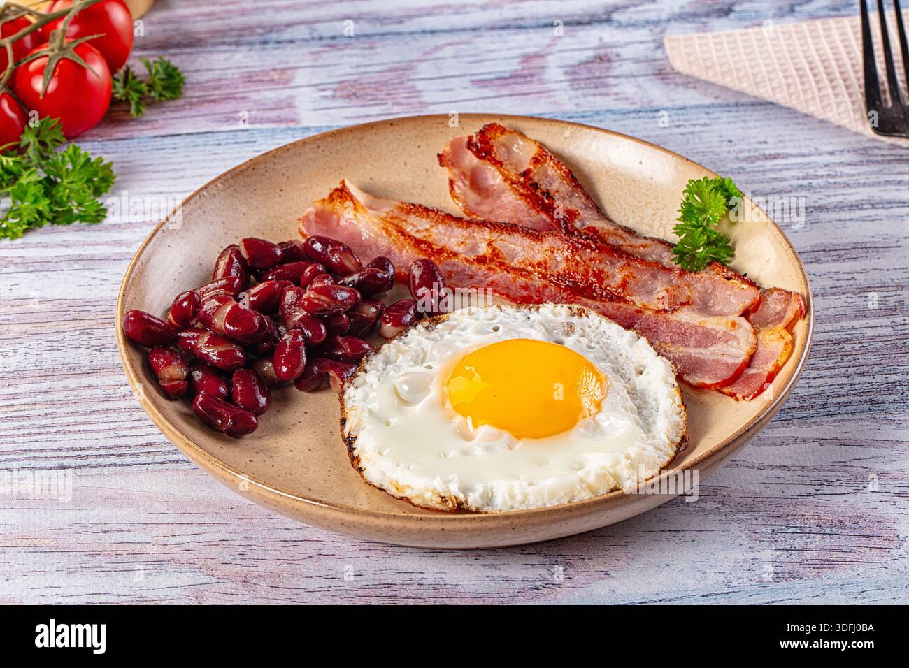 English breakfast with egg, bean and fried bacon Stock Photo - Alamy