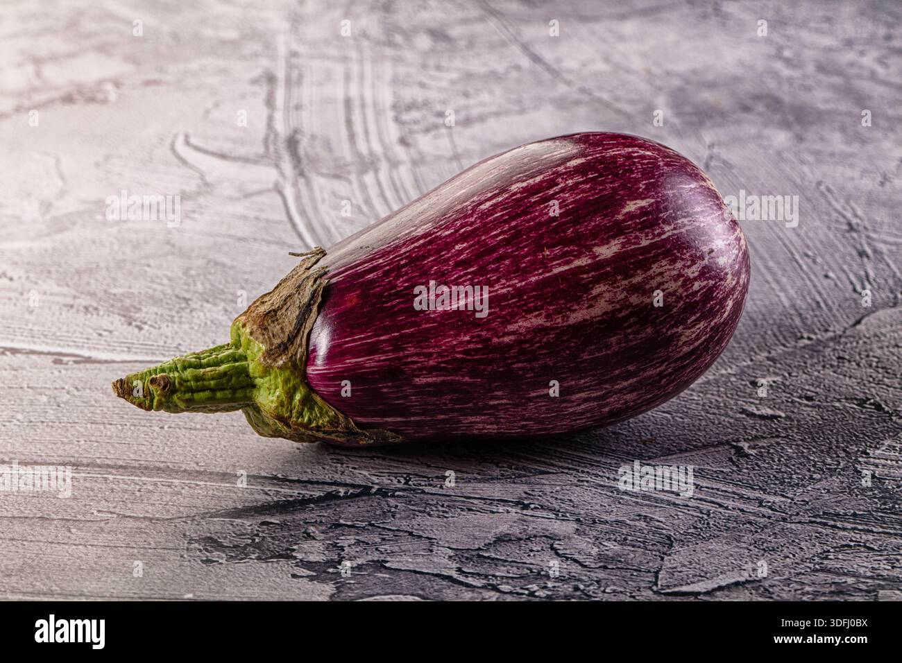 Stripped violet graffiti eggplant vegetable for cooking Stock Photo - Alamy