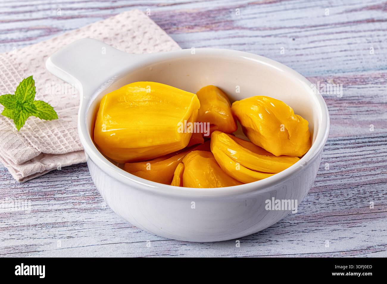 Canned sweet juicy yellow Jackfruit segment Stock Photo - Alamy